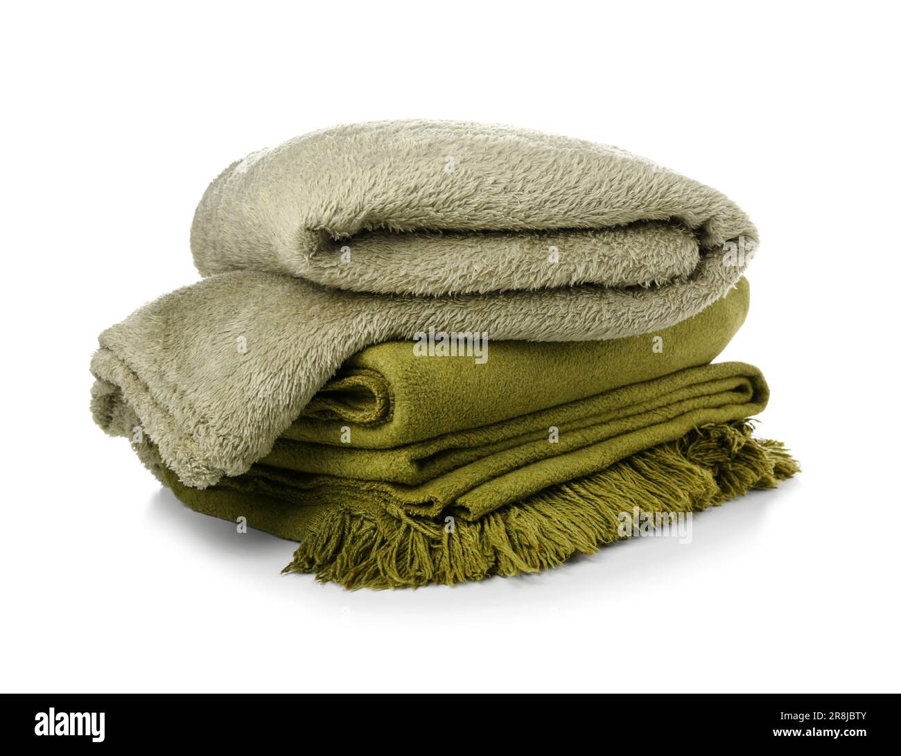 Different soft folded blankets on white background Stock Photo - Alamy