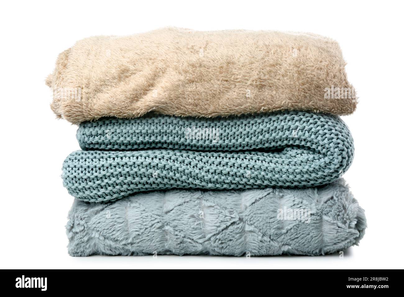 Different soft folded blankets on white background Stock Photo - Alamy