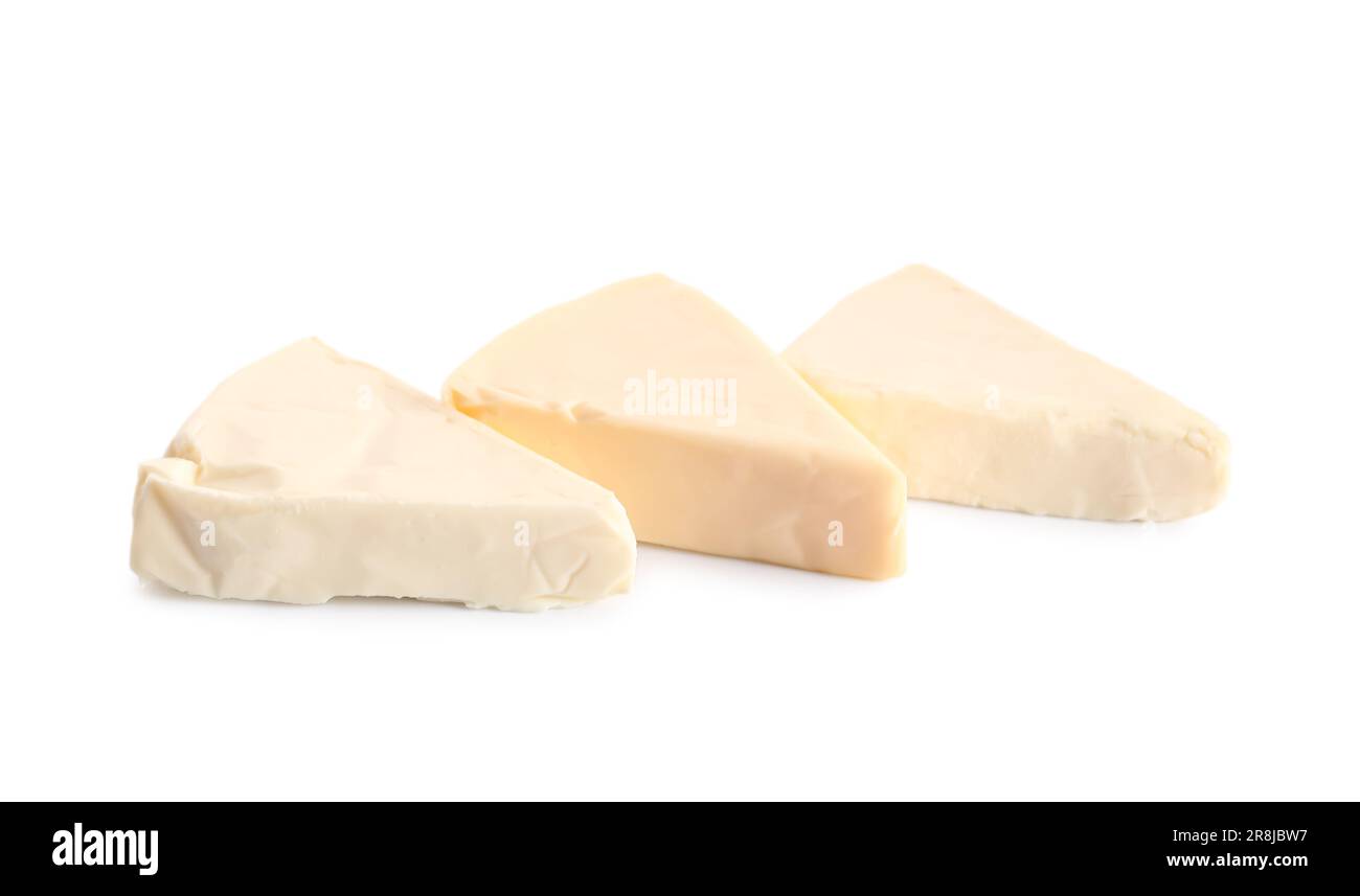 Triangles of tasty processed cheese on white background Stock Photo - Alamy