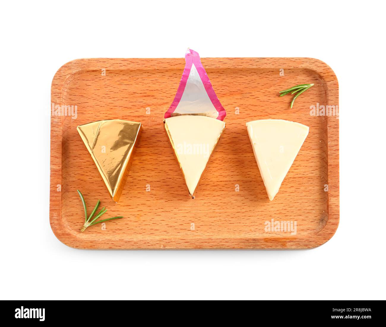Wooden board with triangles of tasty processed cheese on white ...