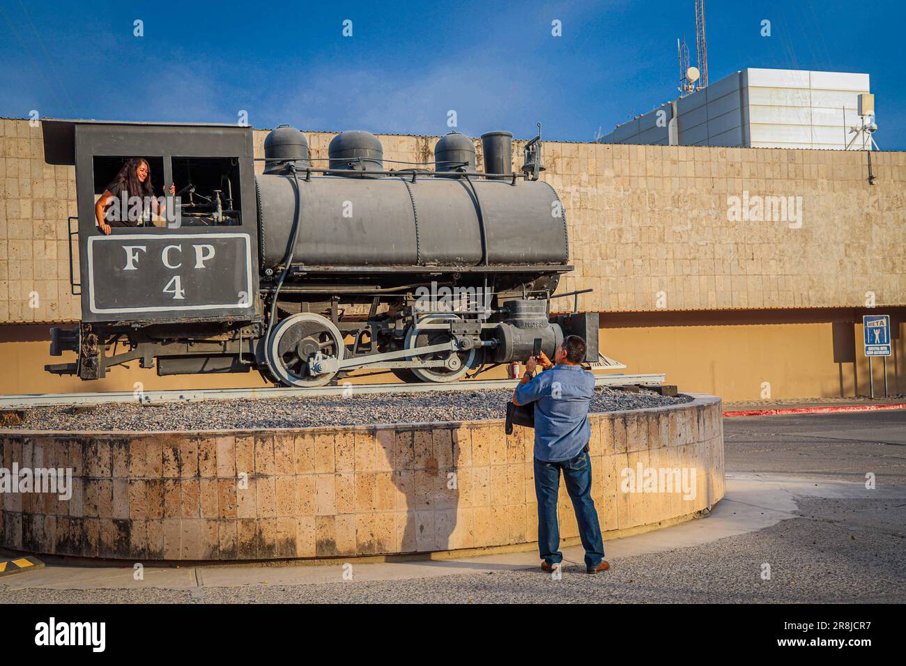 Old coal and steam train machine exhibited in the courtyards in ...