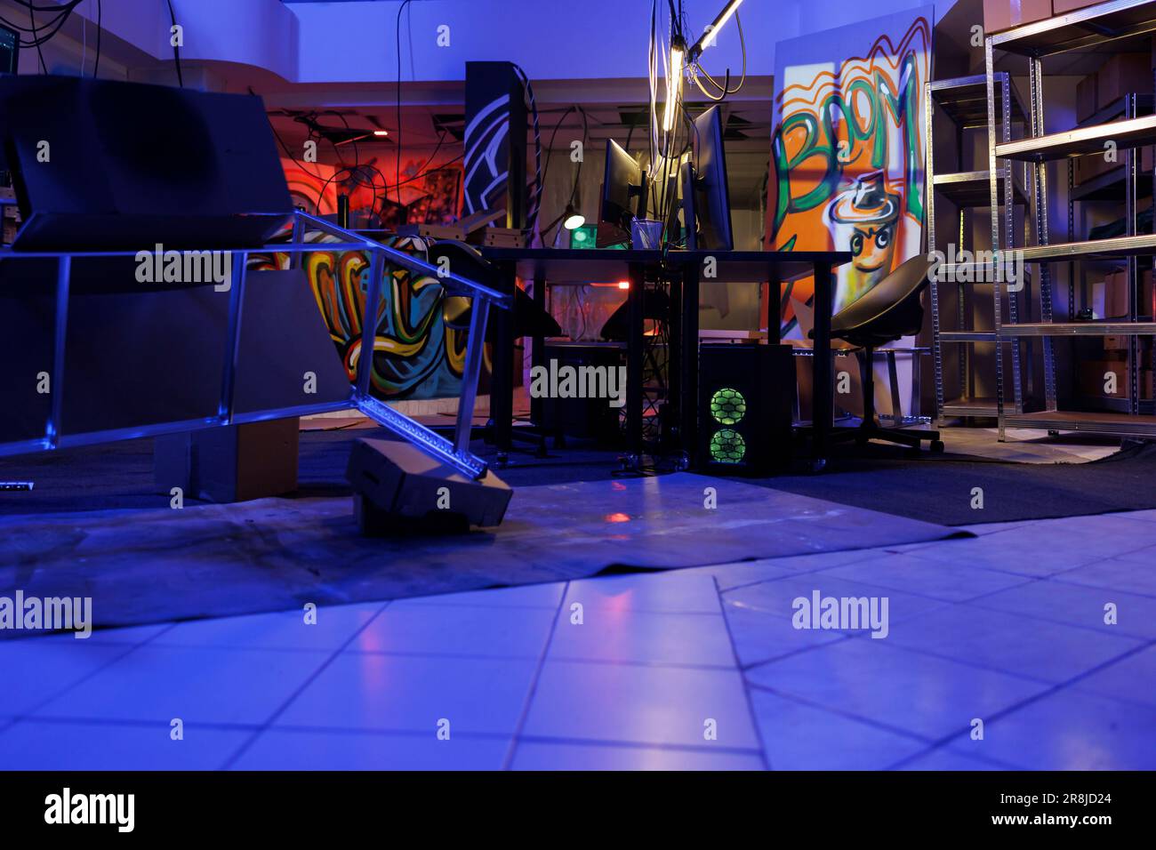 Hackers abandoned warehouse with graffiti and neon light at night ...