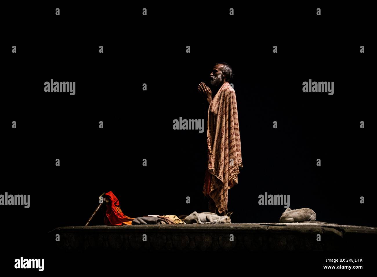 A holy man prays at night on the ghats of Varanasi, India Stock Photo ...