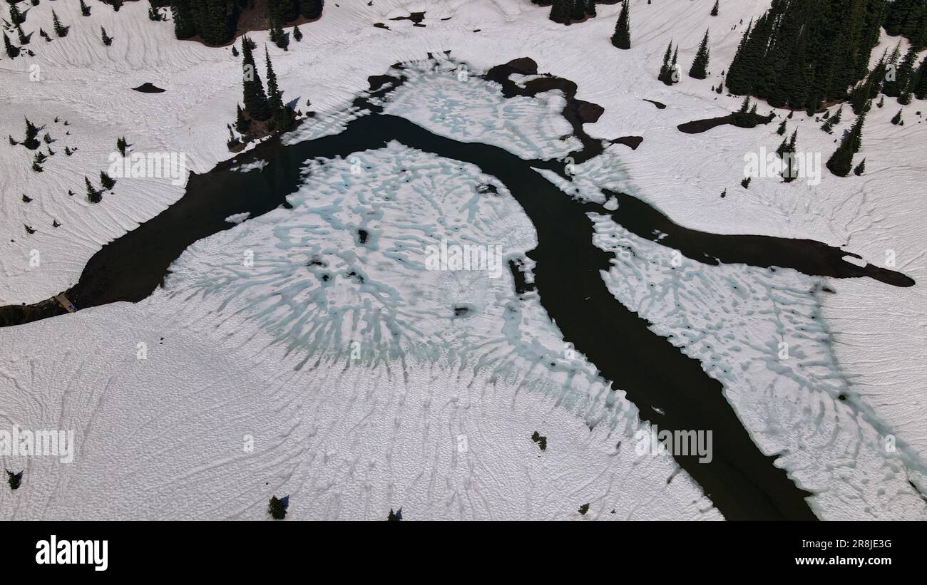 Mount Rainier aerial photograph of split frozen lake Stock Photo - Alamy