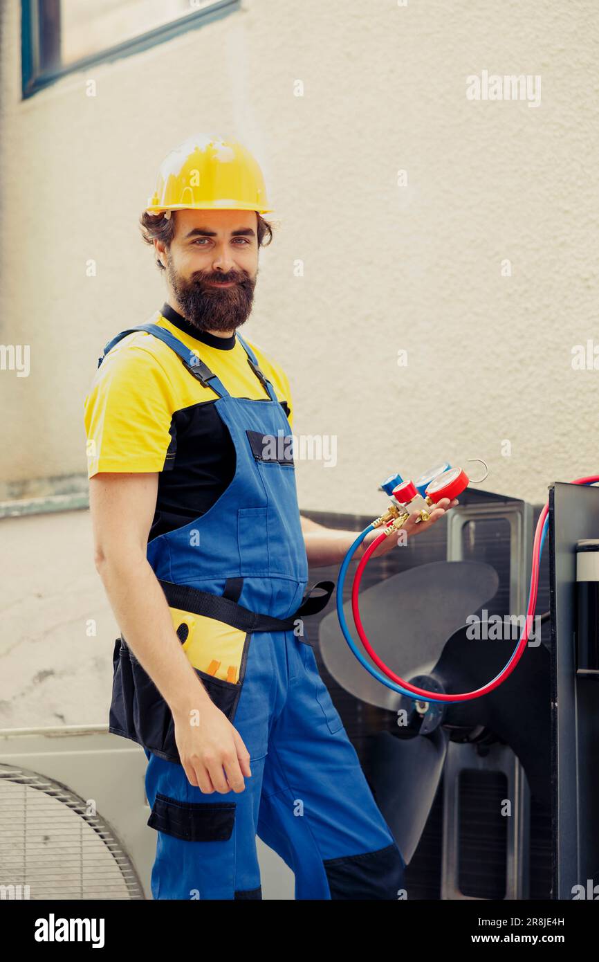 Portrait of smiling experienced technician commissioned for outdoor air ...