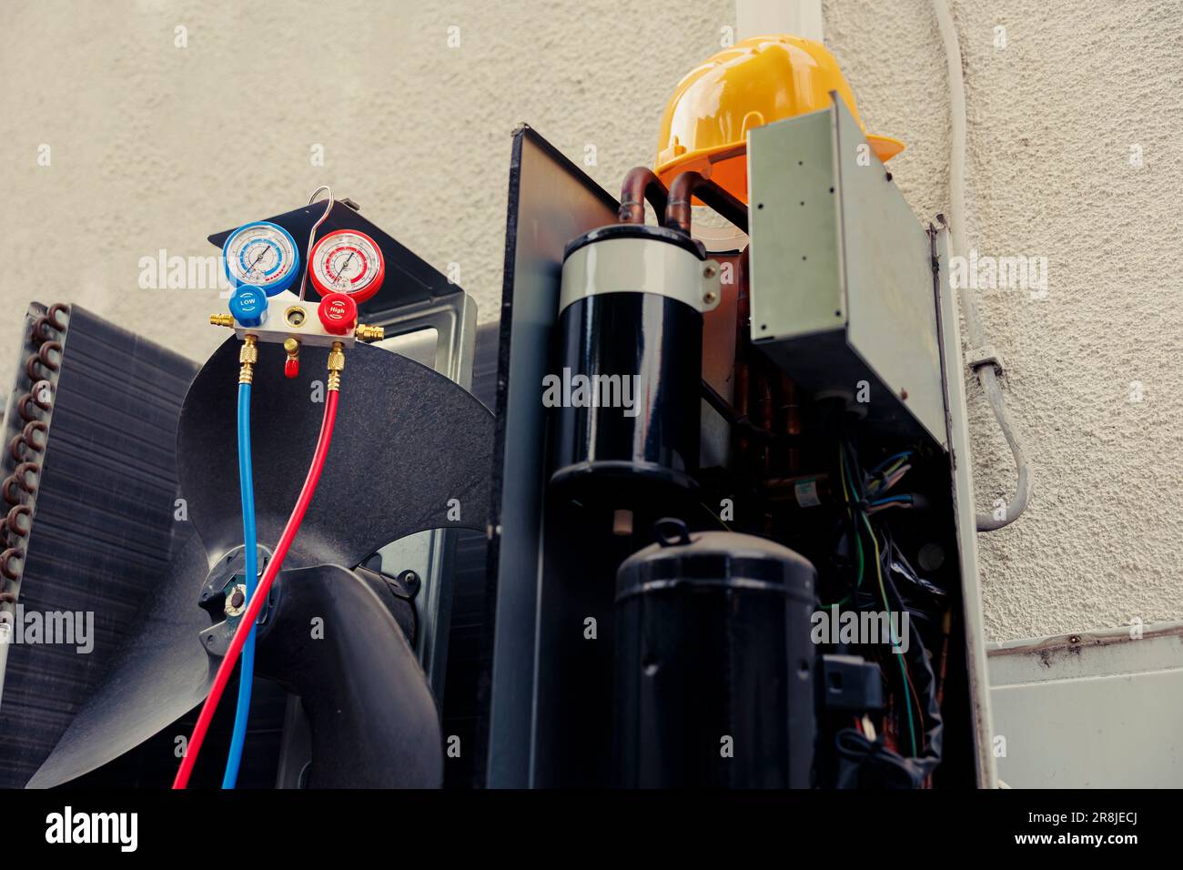 Out of order external air conditioner unit with protection cover ...