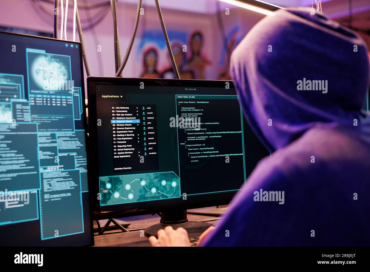 Hacker In Hood Running Illegal Malware On Computer Screen With Multiple Windows Criminal