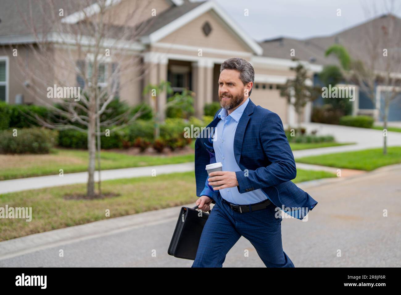 Business man with briefcase and take away coffee run outdoor ...