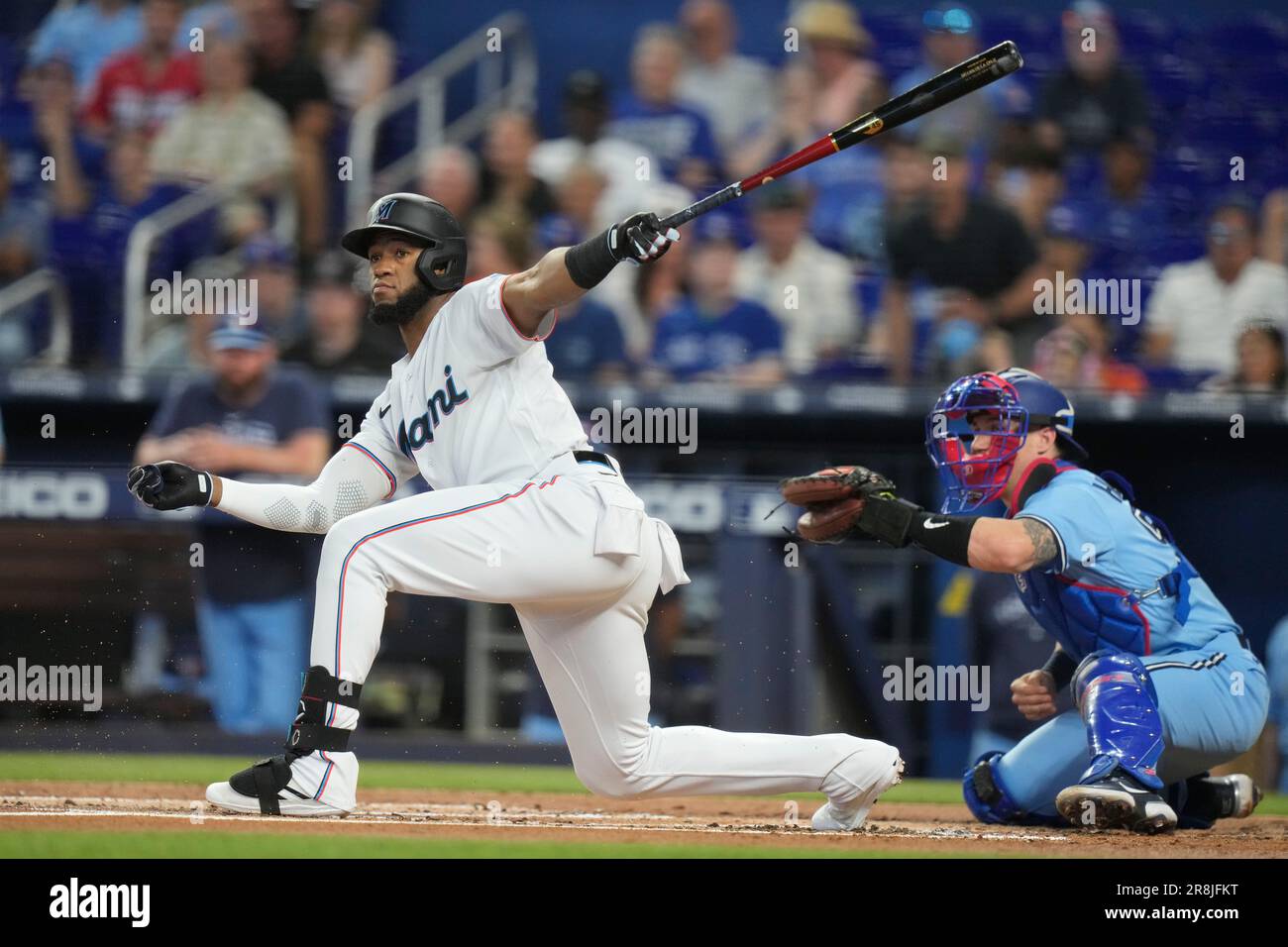 Miami Marlins' Bryan De La Cruz, left, bats as Toronto Blue Jays ...