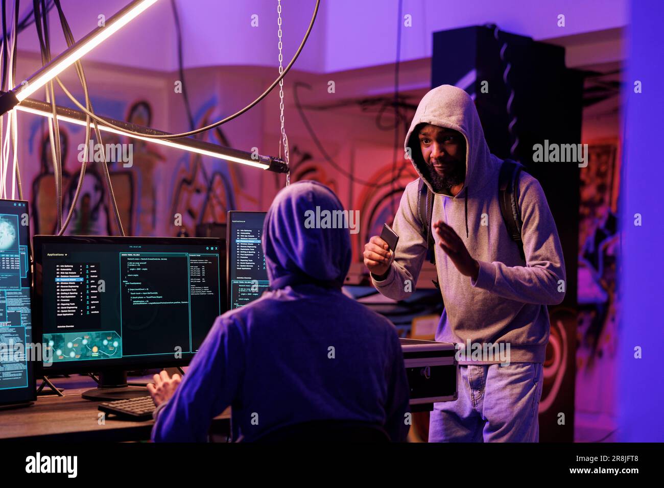 African american hacker holding ssd with illegal malware for password ...