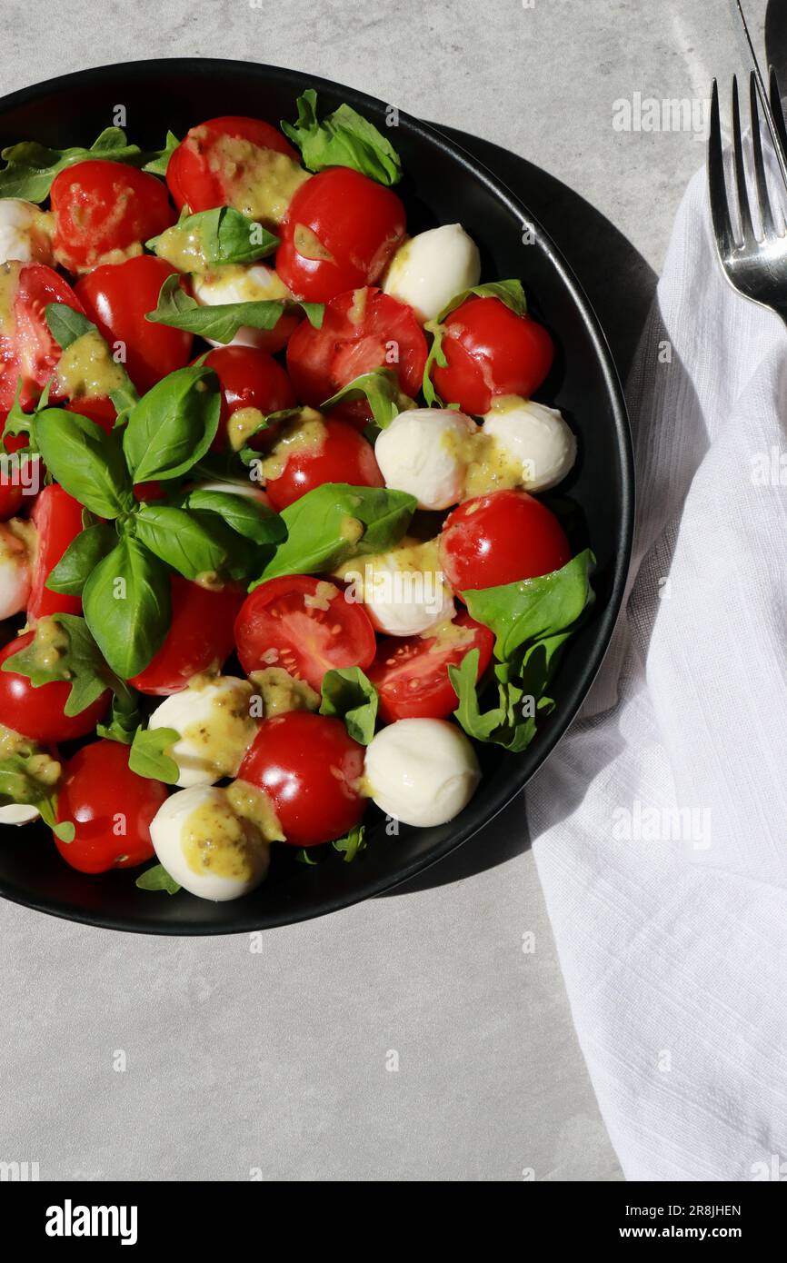 upper view of a delicious Italian capers salad with tomatoes ...