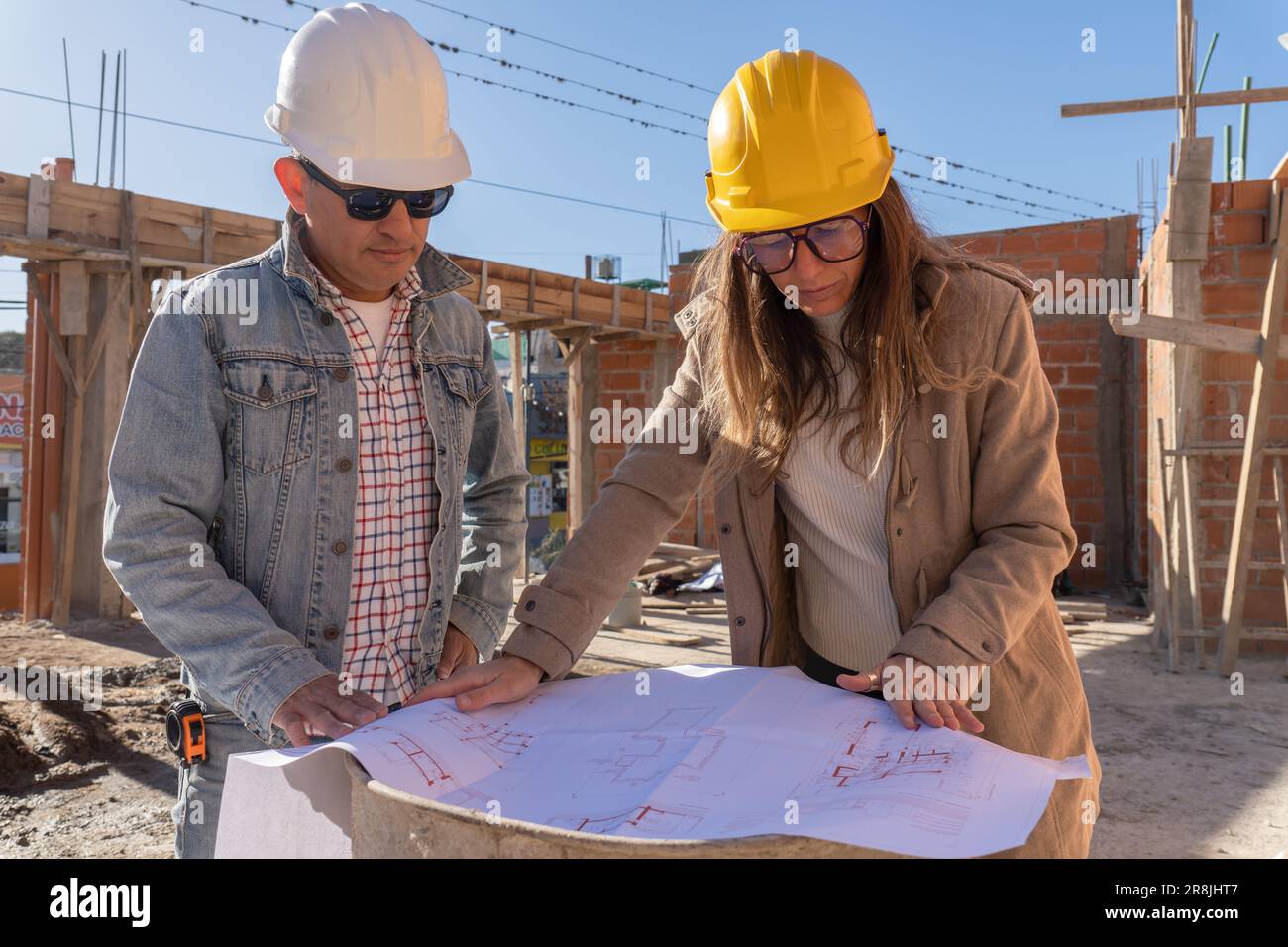 Diversity portrait male and female engineers work together on rooftop of line of site, , both ...