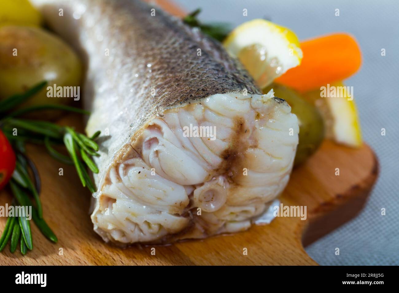 Cod baked in rustic style Stock Photo - Alamy