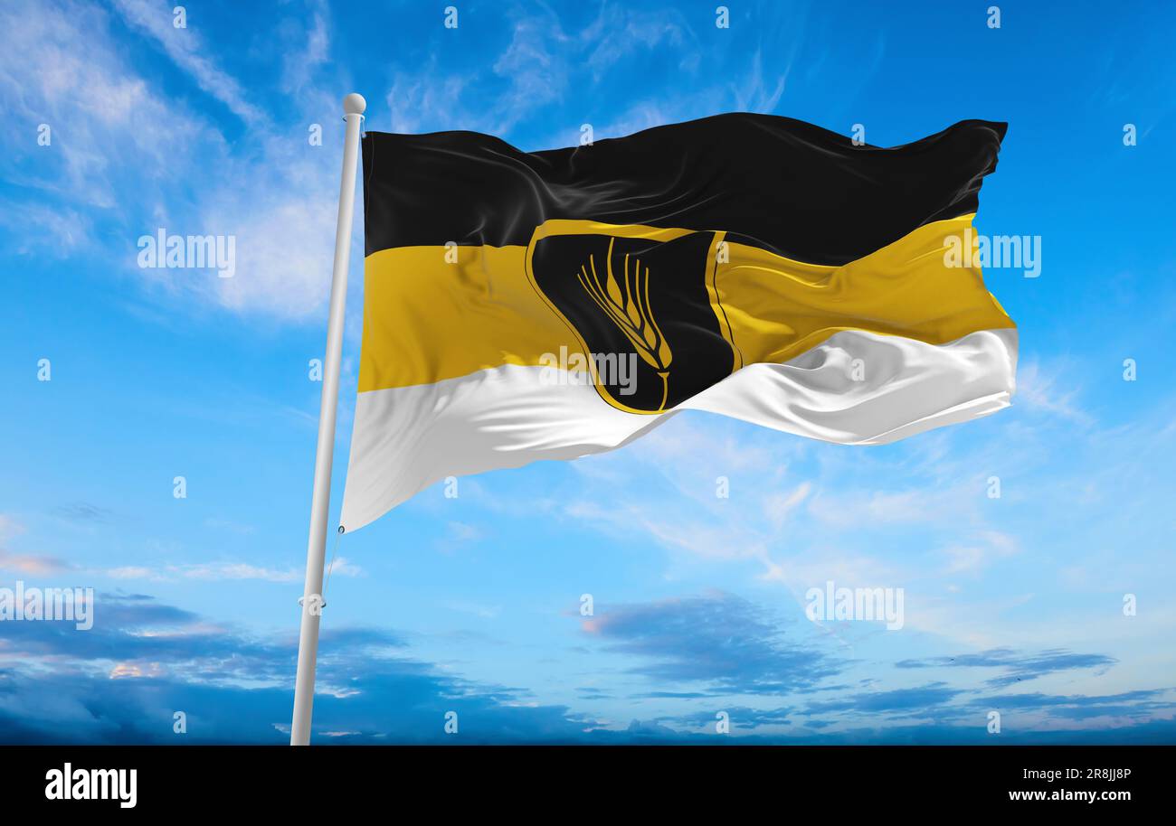 flag of German peoples Volga Germans at cloudy sky background ...