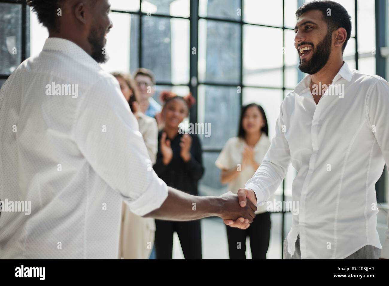 Two hands reach out handshake hi-res stock photography and images - Alamy