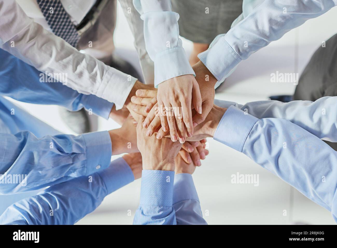 Top view shot of stack of hands. Young college students putting their ...