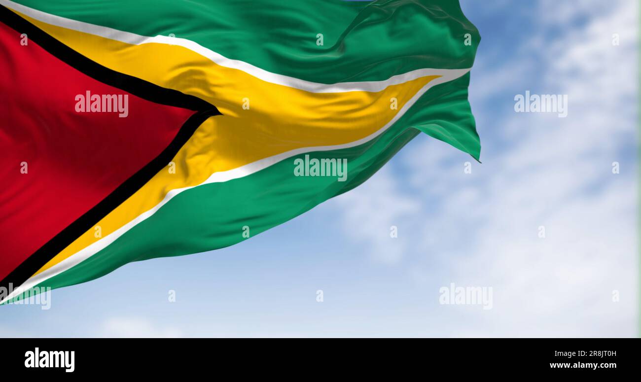 Close-up view of the Guyana national flag waving in the wind on a clear day. South American ...