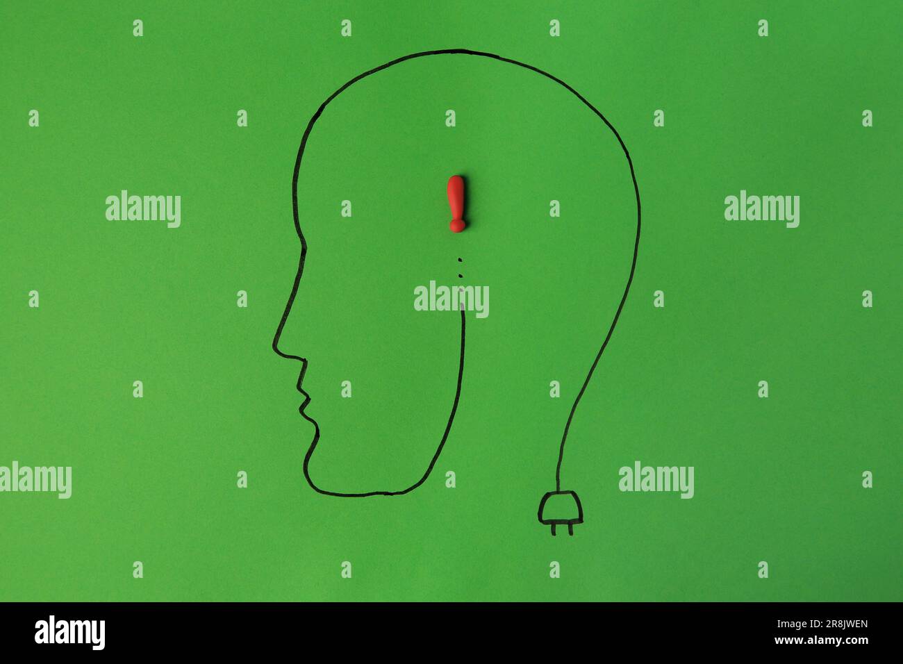 Drawn human head with red exclamation mark as solution idea on green ...