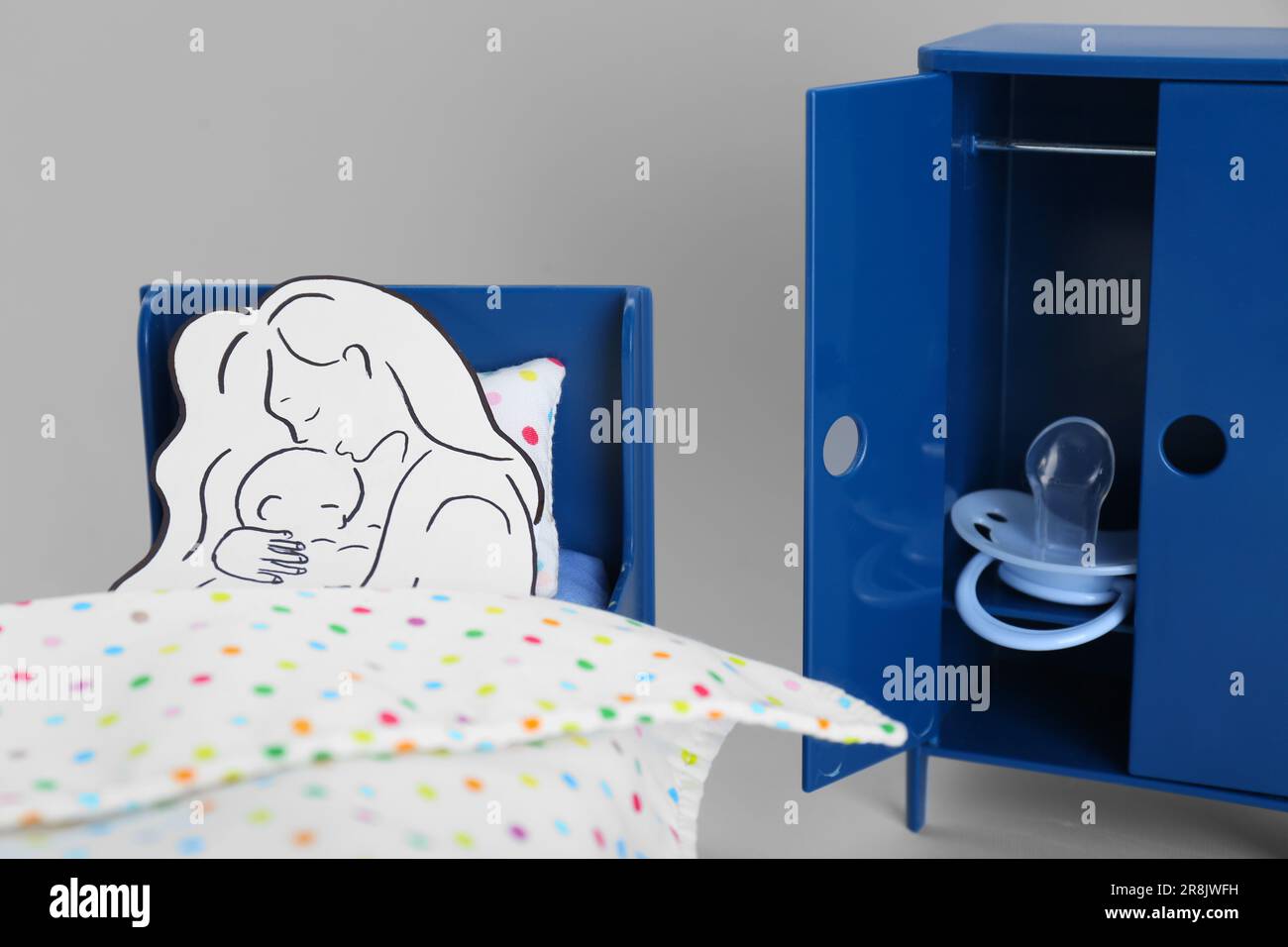 Maternity leave concept. Baby pacifier, paper cutout of mother and ...