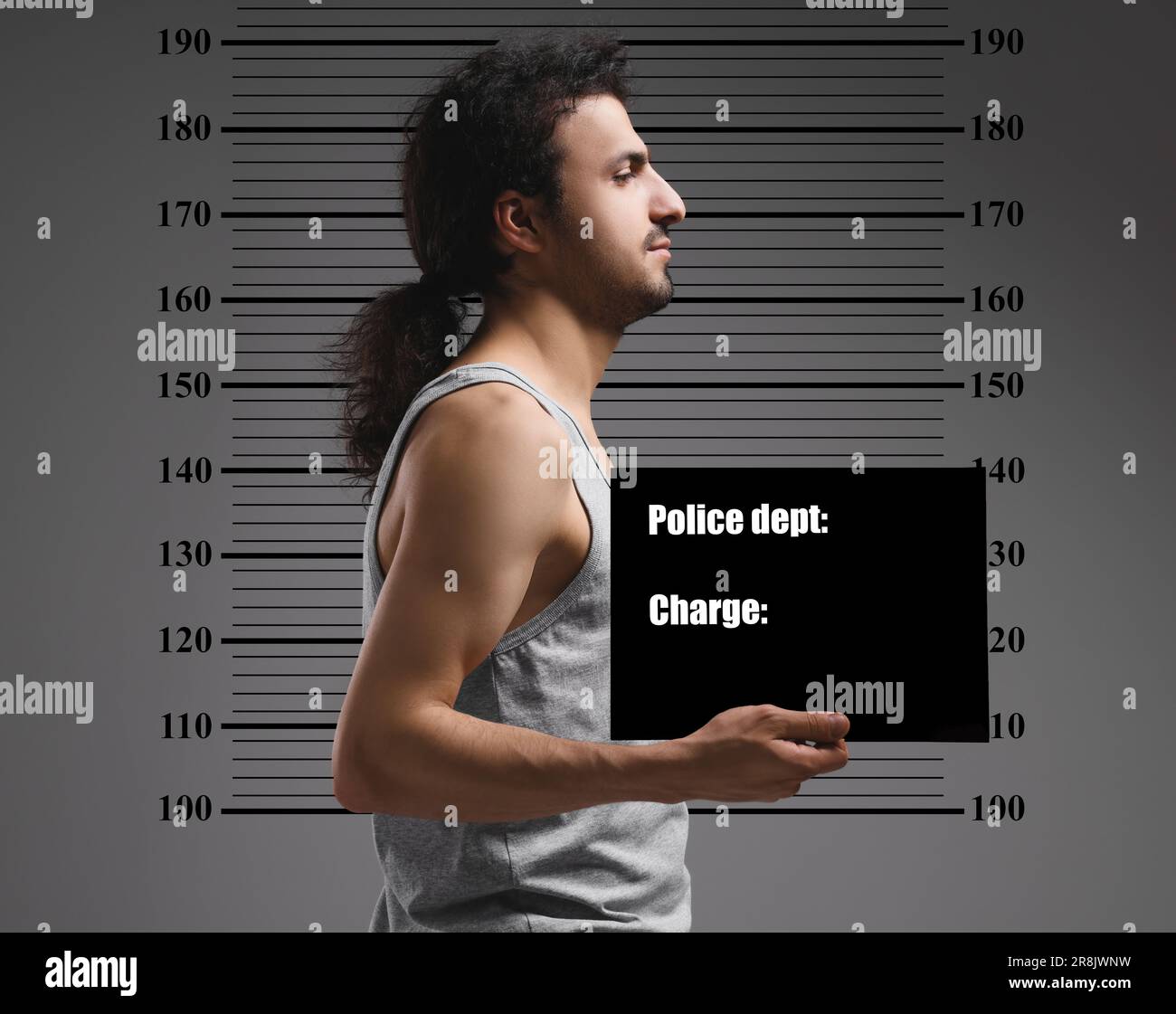Criminal mugshot. Arrested man with blank card against height chart ...