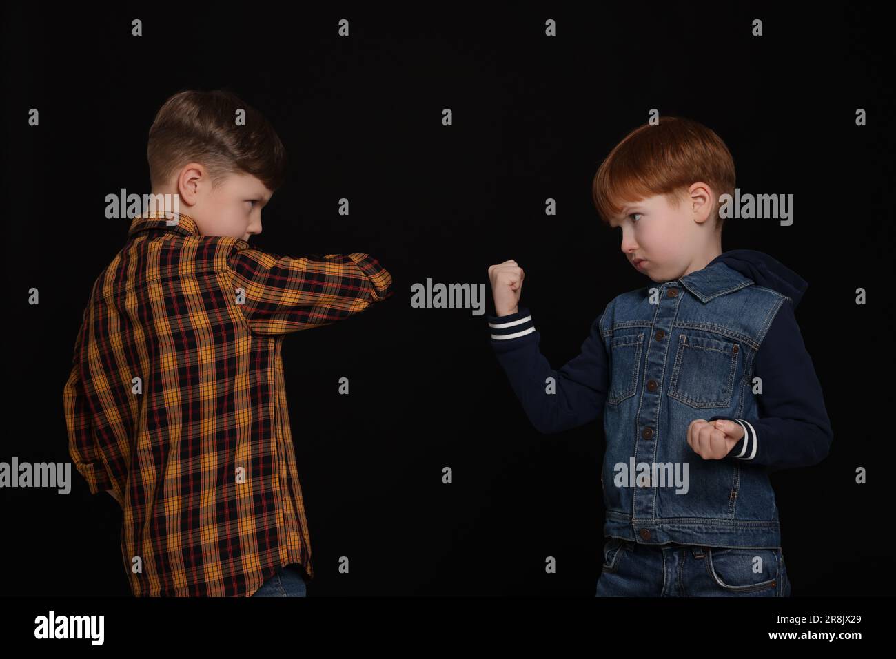 Two boys fighting on white background. Children's bullying Stock Photo ...