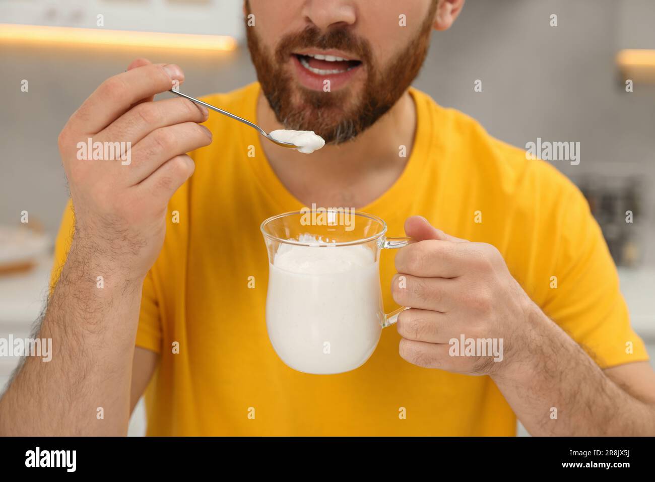 Yogurt man eating hi-res stock photography and images - Alamy