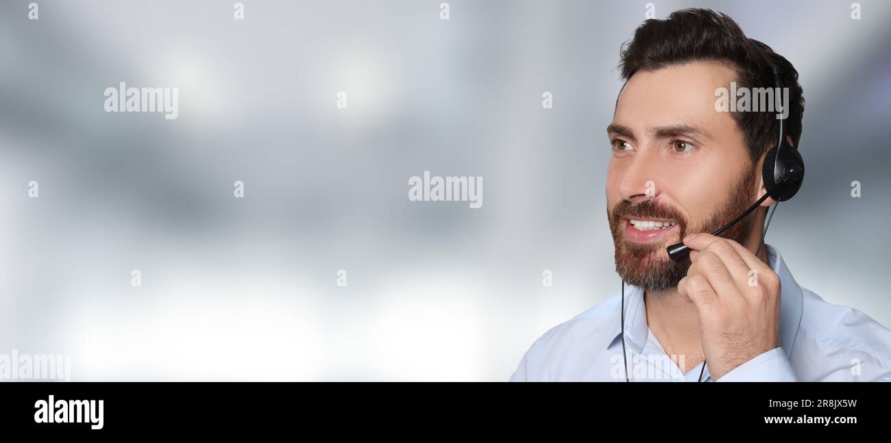 Hotline operator with headset in office, space for text. Banner design ...