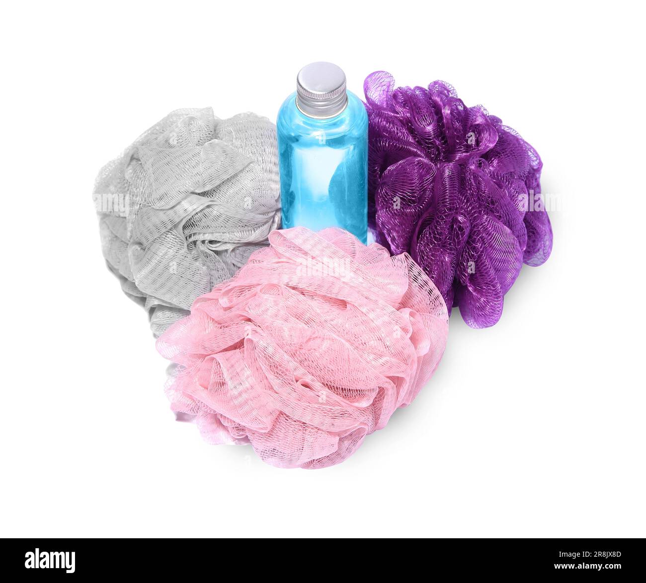 New shower puffs and bottle of cosmetic product on white background ...