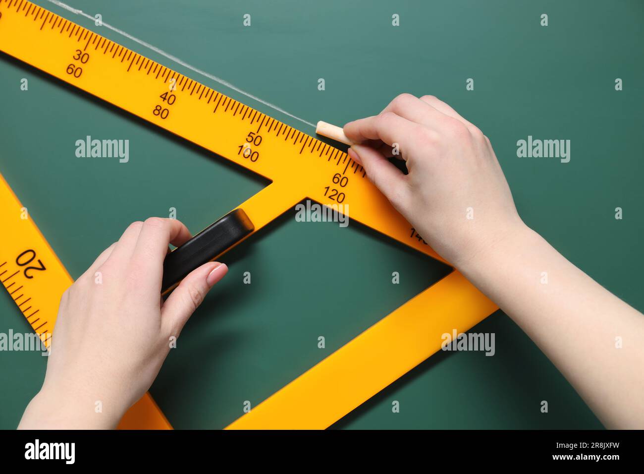 Hands measuring angle by protractor hi-res stock photography and images ...