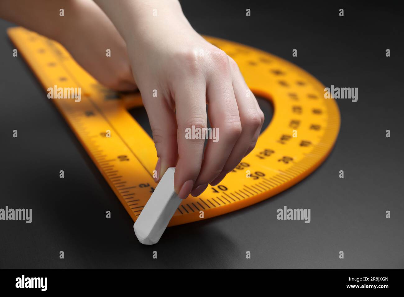 Hands measuring angle by protractor hi-res stock photography and images ...