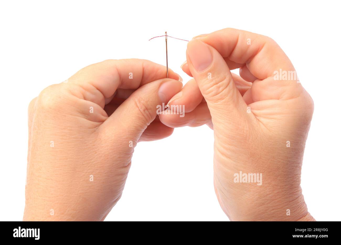 Woman threading sewing needle on white background, closeup Stock Photo ...