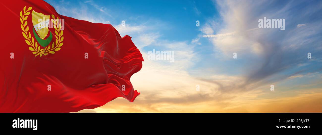 official flag of Kedah Malaysia at cloudy sky background on sunset ...