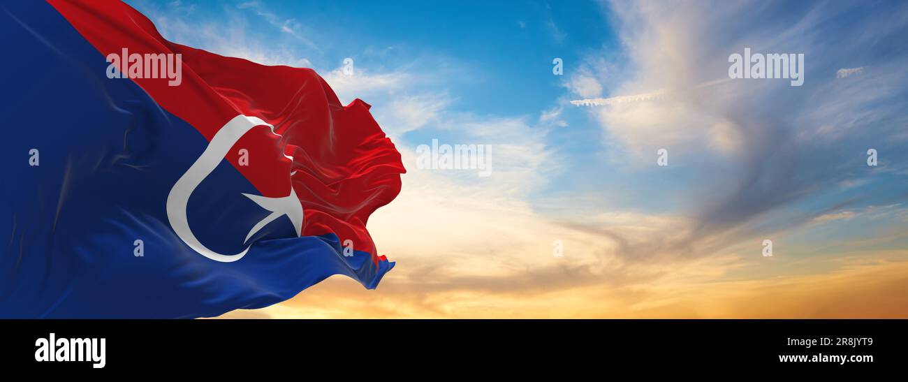 official flag of Johor Bahru, Johor Malaysia at cloudy sky background ...