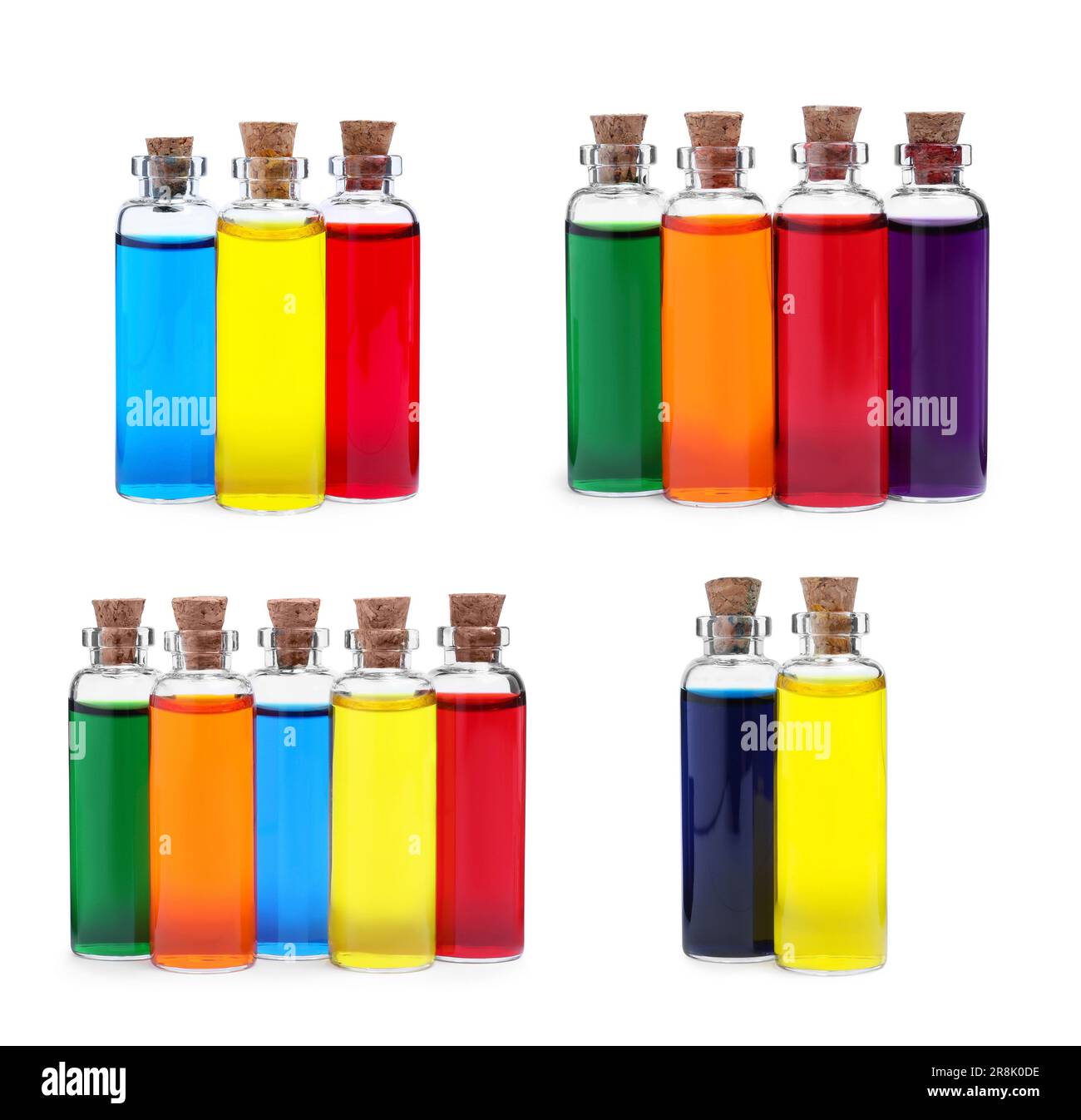 Collage of glass bottles with different food coloring isolated on white ...
