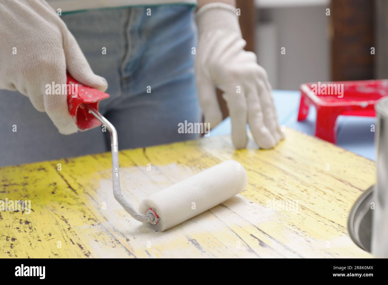 Painting using yellow paint roller hi-res stock photography and images ...
