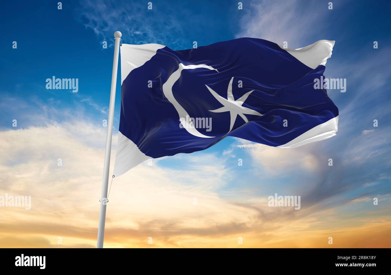 official flag of Bendera Permaisuri Johor Malaysia at cloudy sky background on sunset, panoramic ...