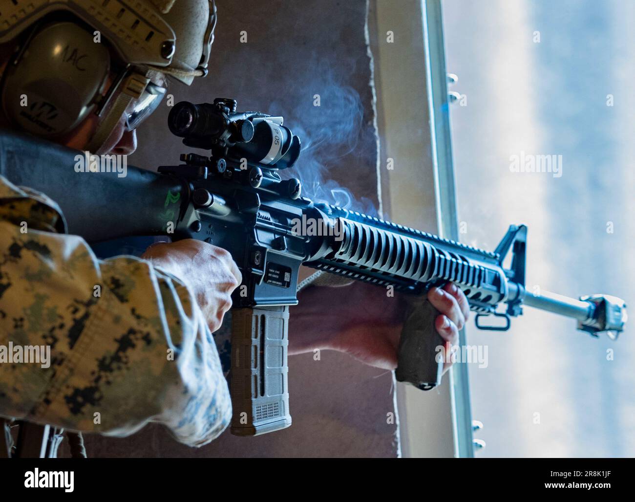 A U.S. Marine with 2nd Air Naval Gunfire Liaison Company fires at a ...