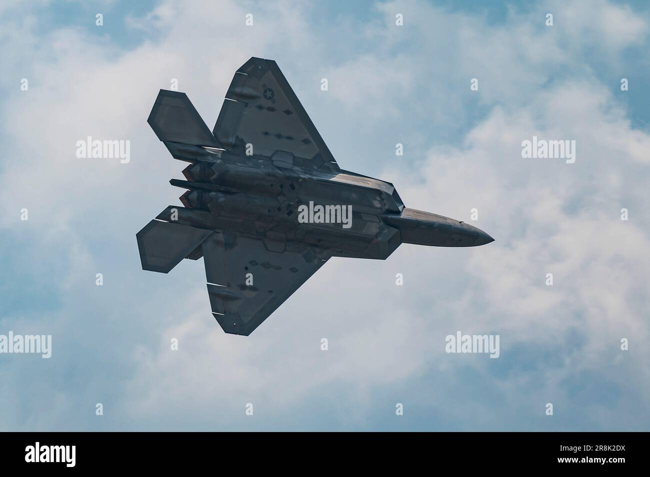 An aircraft from the U.S. Air Force F-22 Raptor Demo Team, piloted by ...