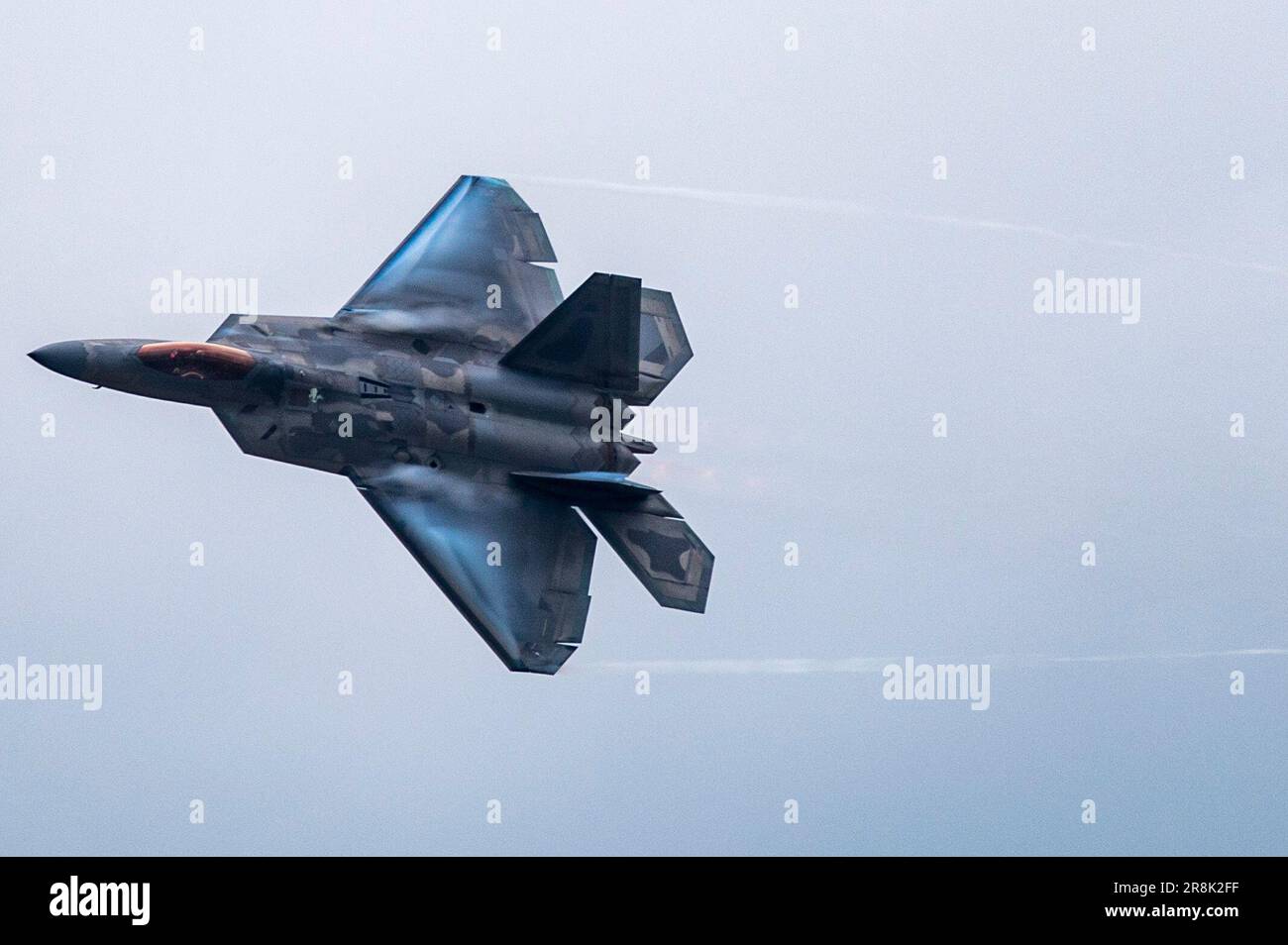A U.S. Air force F-22 Raptor from the F-22 Raptor Demo Team flies over ...