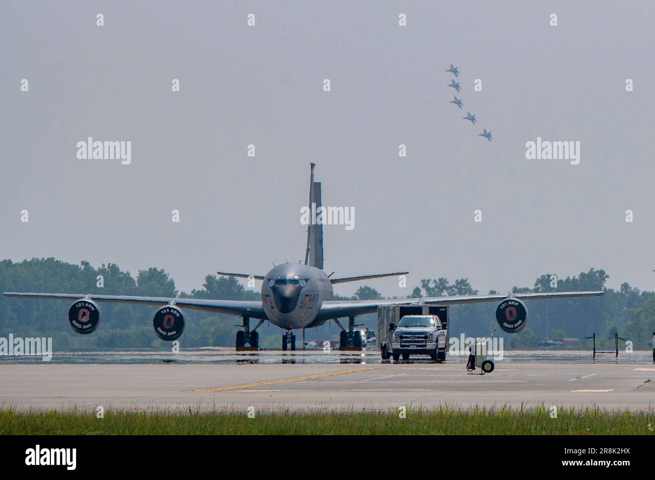 The U.S. Navy Blue Angels fly over an Air Force KC-135 Stratotanker ...