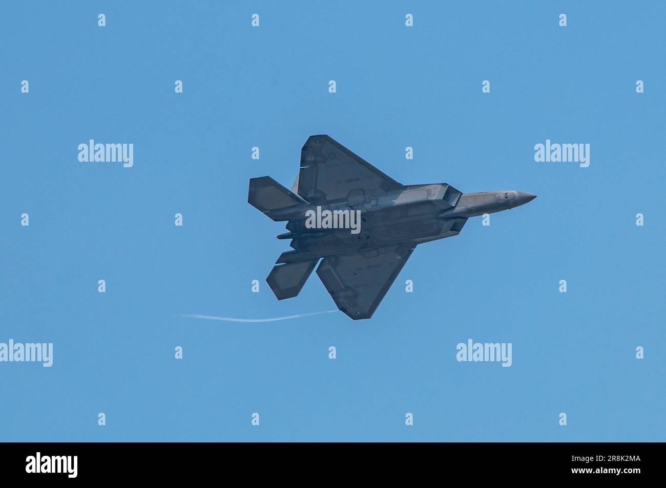 A U.S. Air Force F-22 Raptor performs a demonstration flight flight ...
