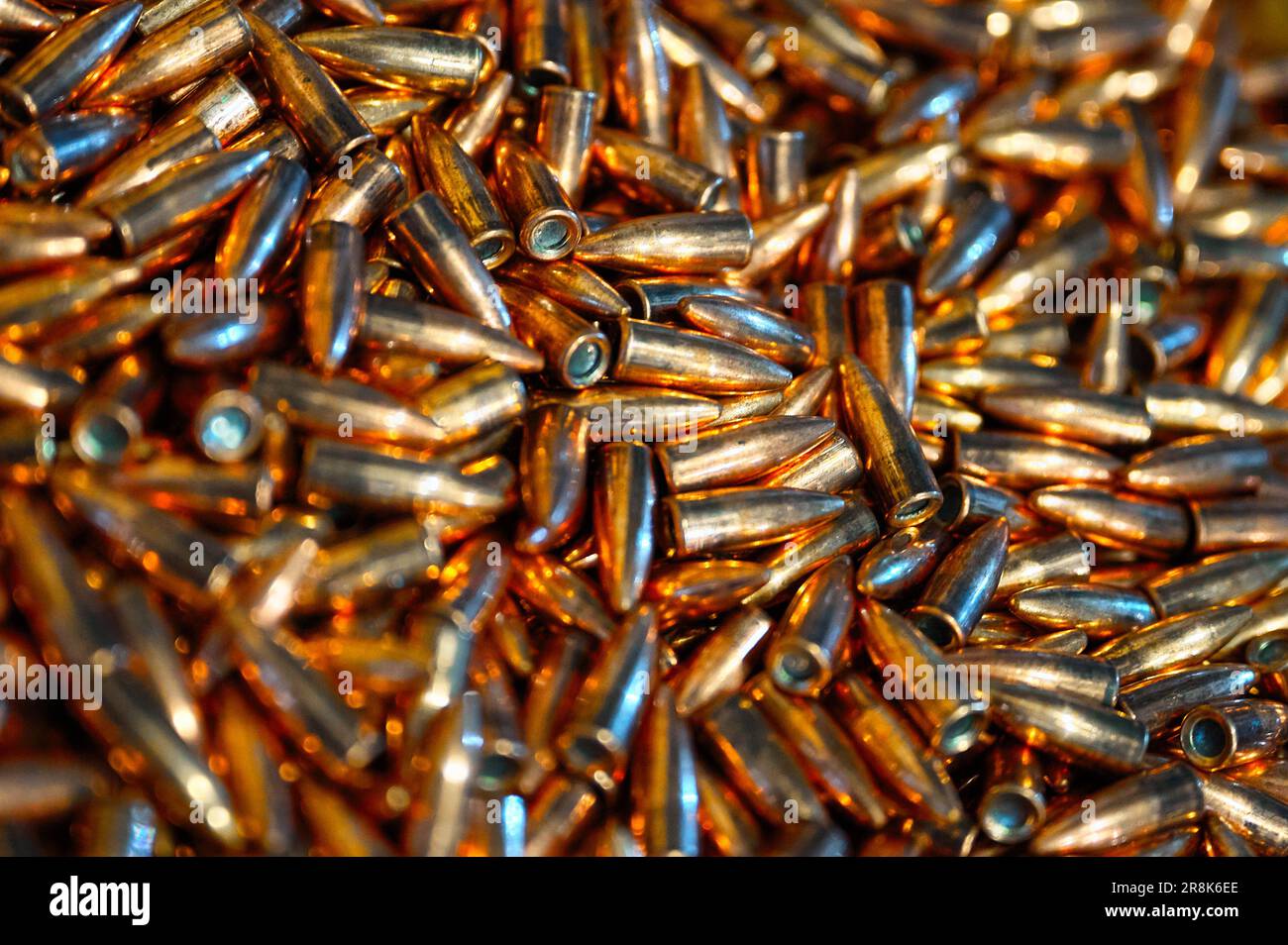 Copper bullet pile for riffle as background Stock Photo - Alamy