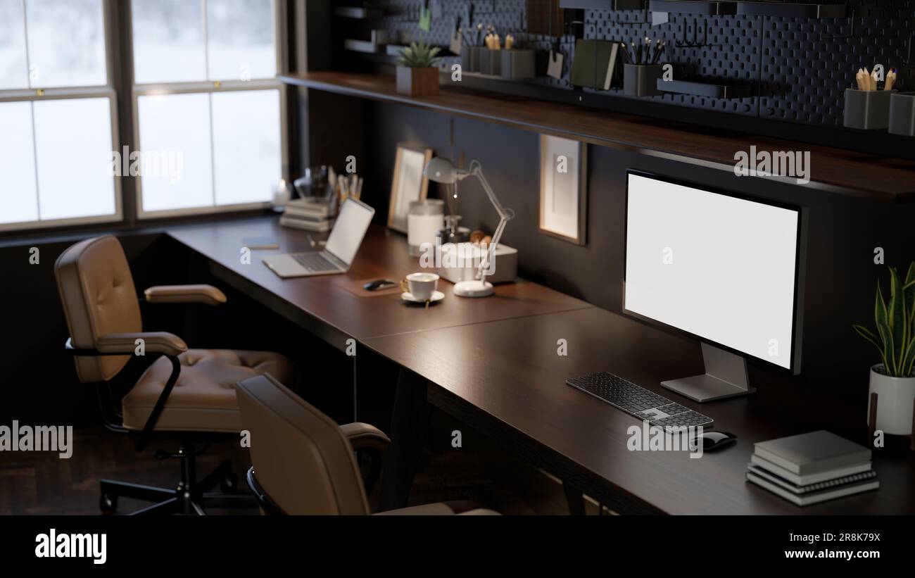 A modern dark loft home office with computer blank screen mockup and ...
