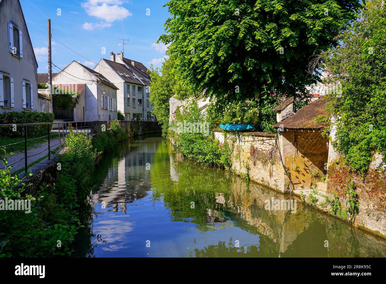 Flowered embankment of the Grand Morin river in Crécy la Chapelle, a ...