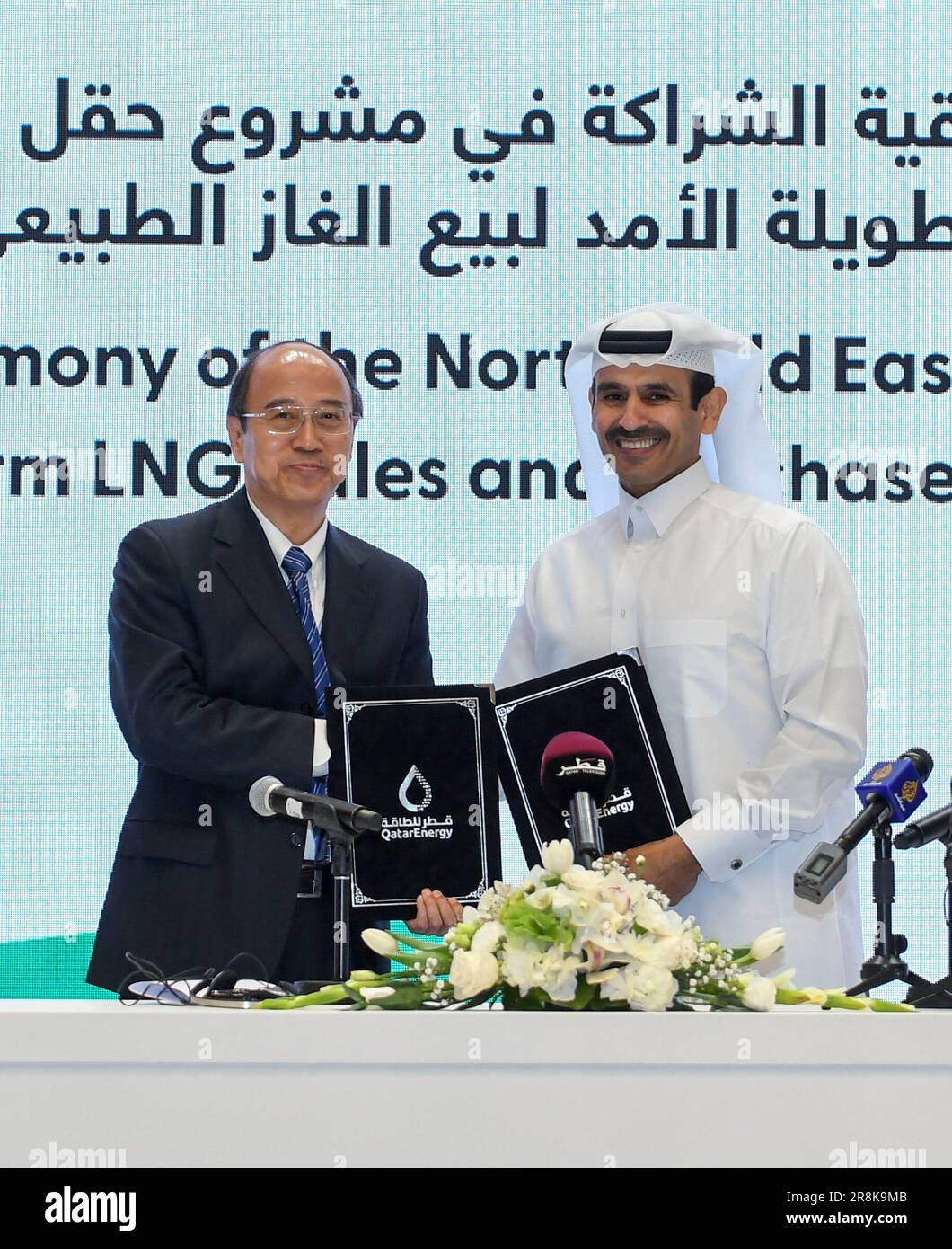 Doha, Qatar. 20th June, 2023. Dai Houliang (L), the chairman of CNPC ...