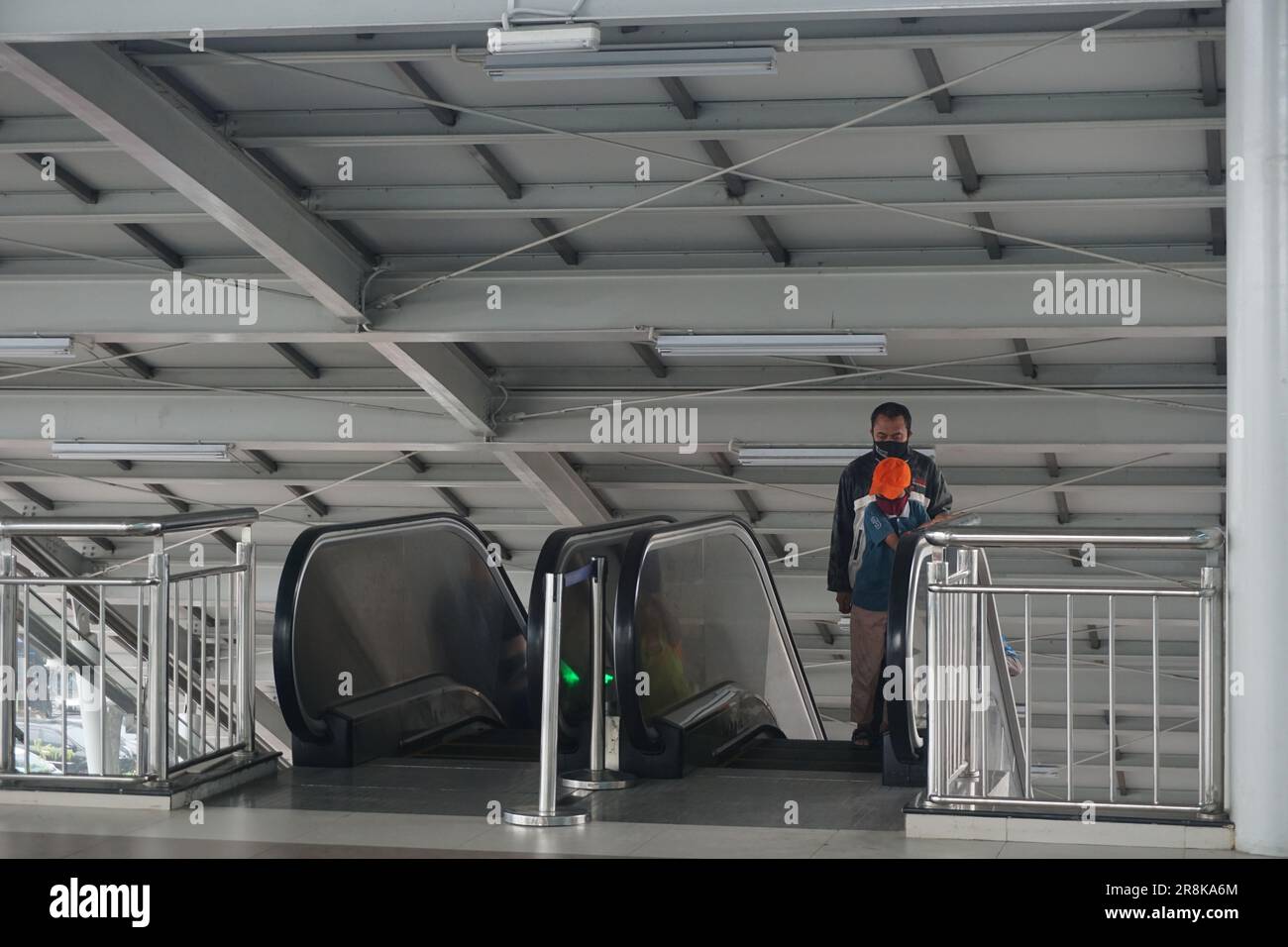 you can see train security giving instructions to train passengers near ...