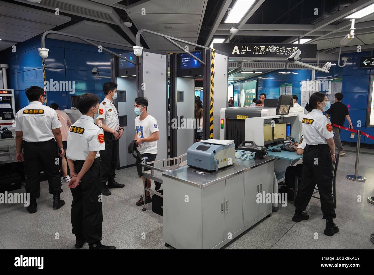 Guangzhou, China. 21st June, 2023. Security guards stand alert at the subway station in ...