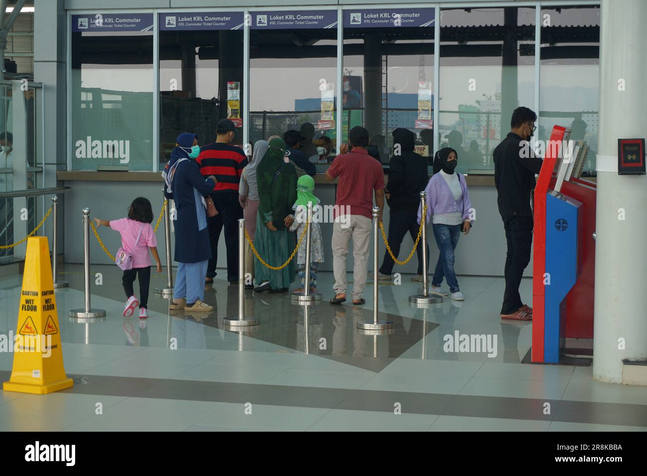 passengers lining up to buy tickets Stock Photo - Alamy