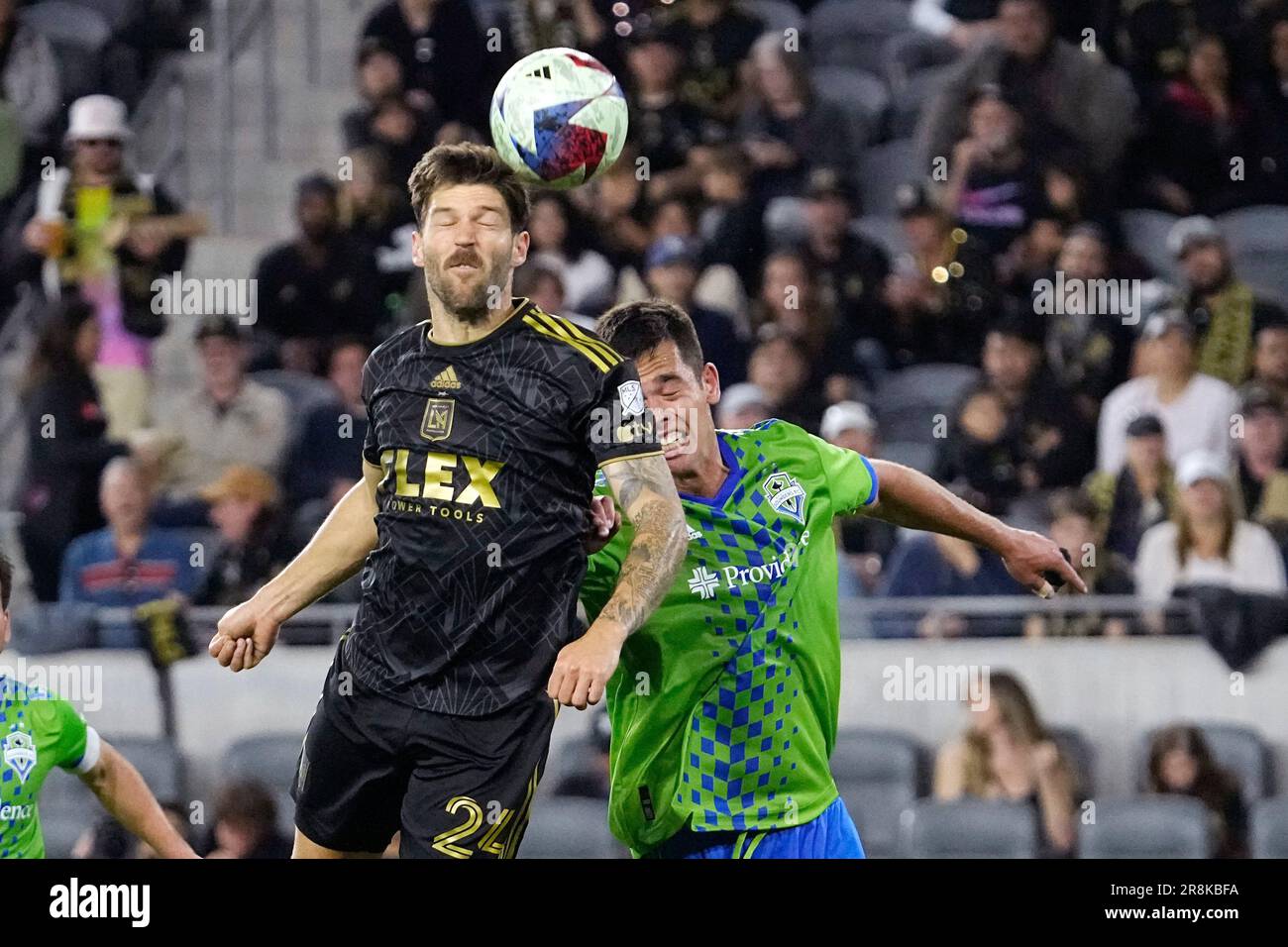 Los Angeles FC midfielder Ryan Hollingshead, left, heads the ball as ...