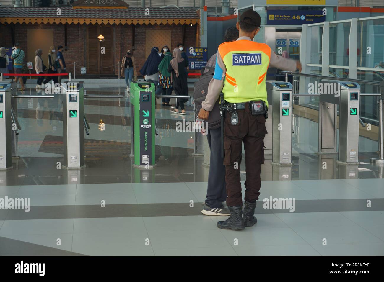 you can see the train security giving instructions to train passengers ...